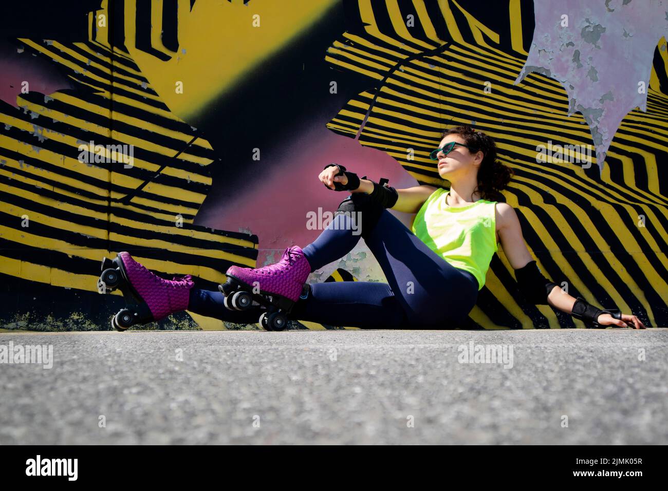 Young girl doing gymnastics with roller skates Stock Photo - Alamy