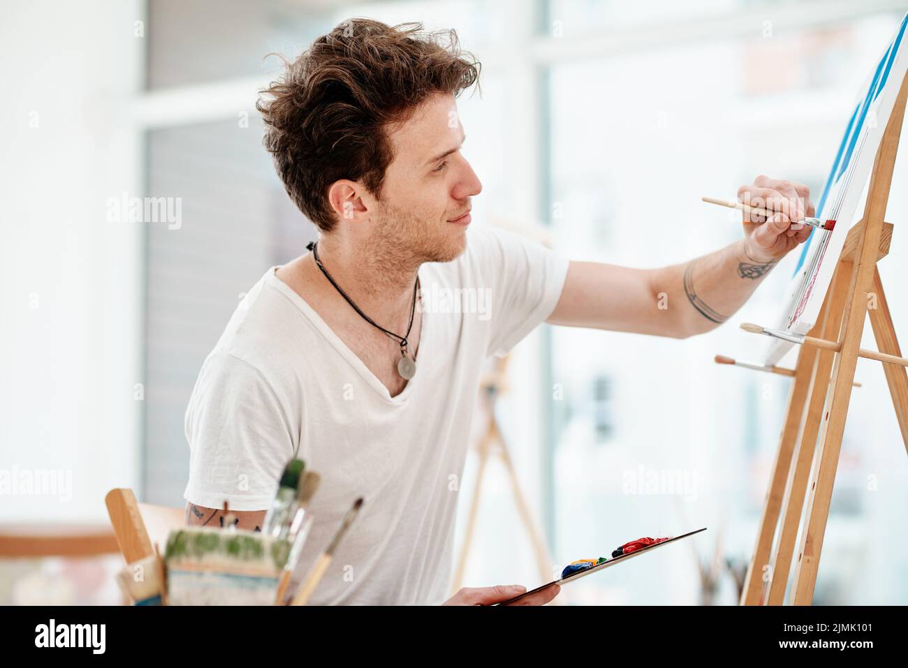 Learn to flow with your creative spirit. a handsome young artist ...