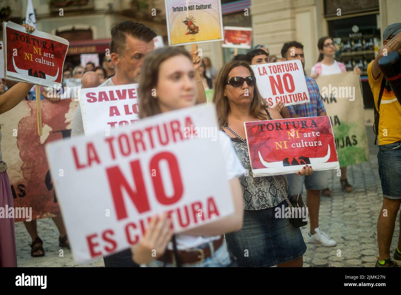 Animal rights activists are seen holding placards as they take part in ...