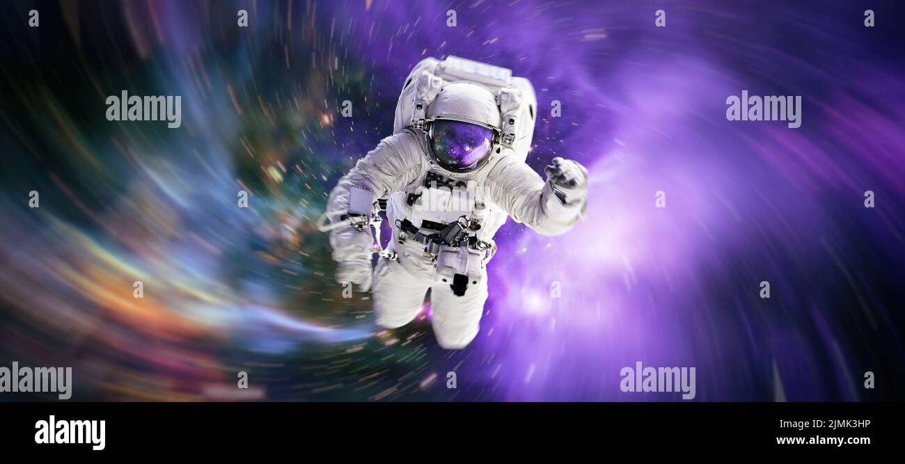 Astronaut in space in the solar system Earth. Blue light on background ...