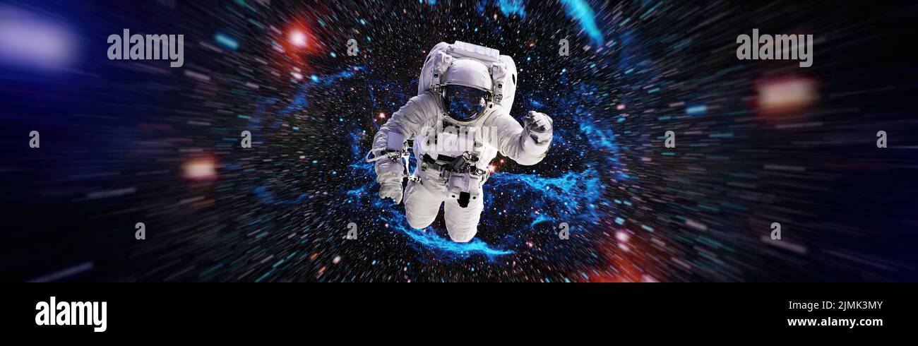 Astronaut in space in the solar system Earth. Blue light on background ...