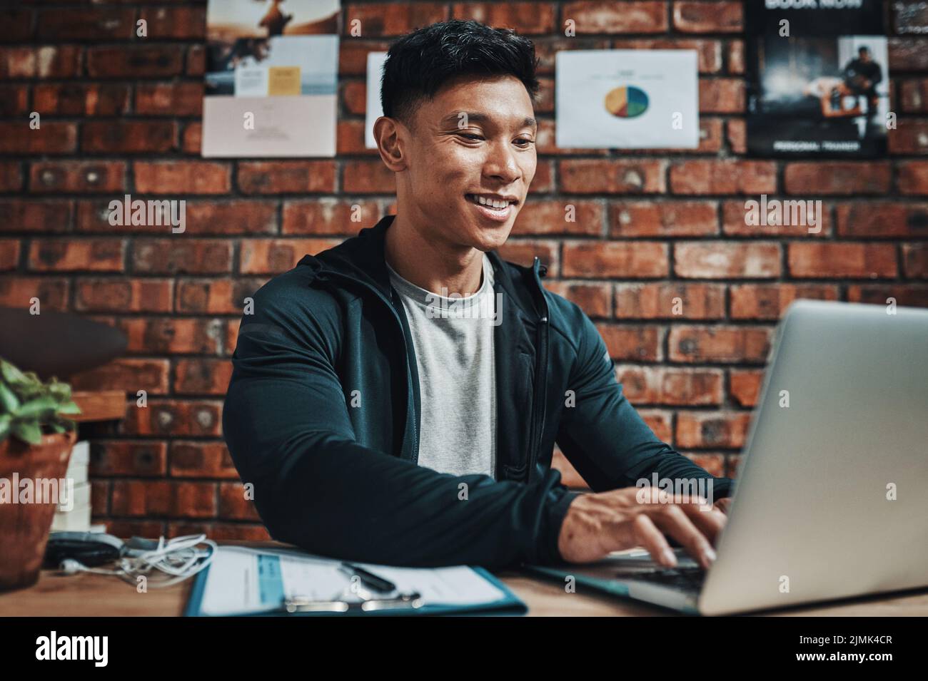 More and more people are signing up for the gym online. a handsome ...