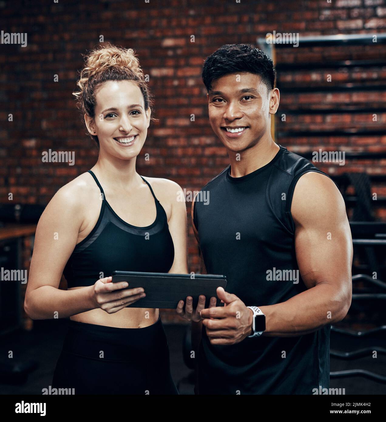 Check out our website for awesome workout routines. two sporty young ...