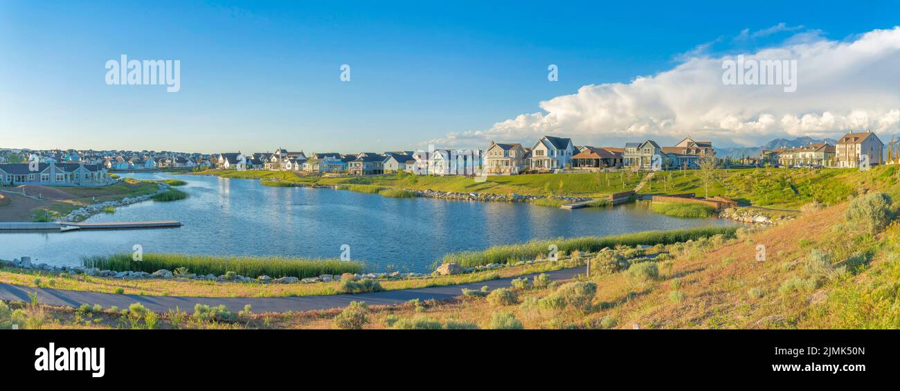 Residential houses surrounding the Oquirrh Lake at Daybreak, South ...