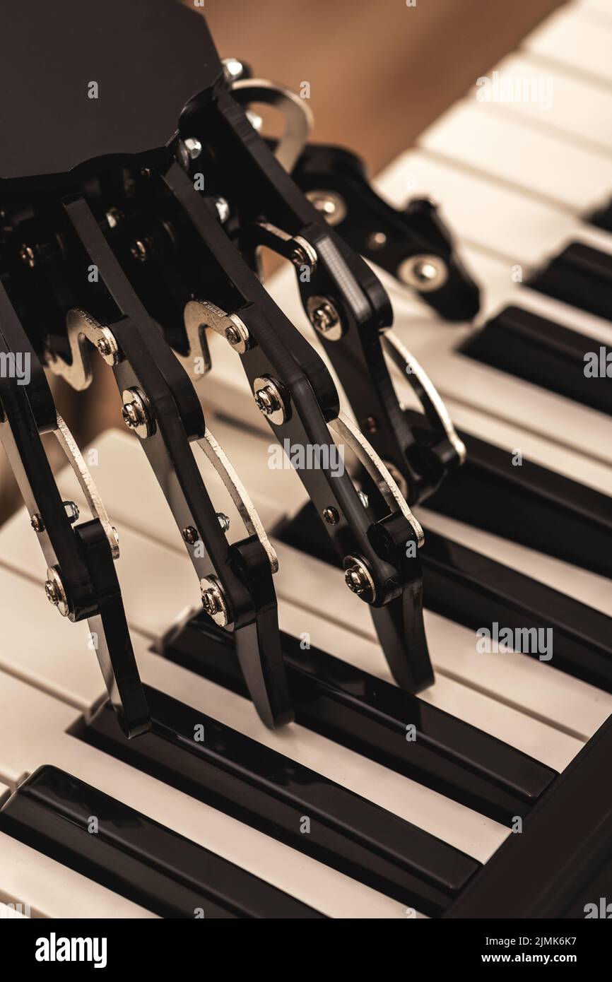 Human with neural hand prosthesis playing piano Stock Photo - Alamy