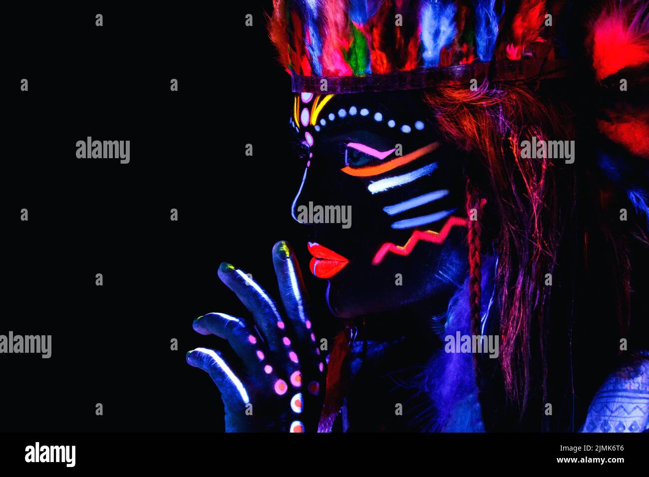 Model in image of Native american with neon makeup, which made of ...