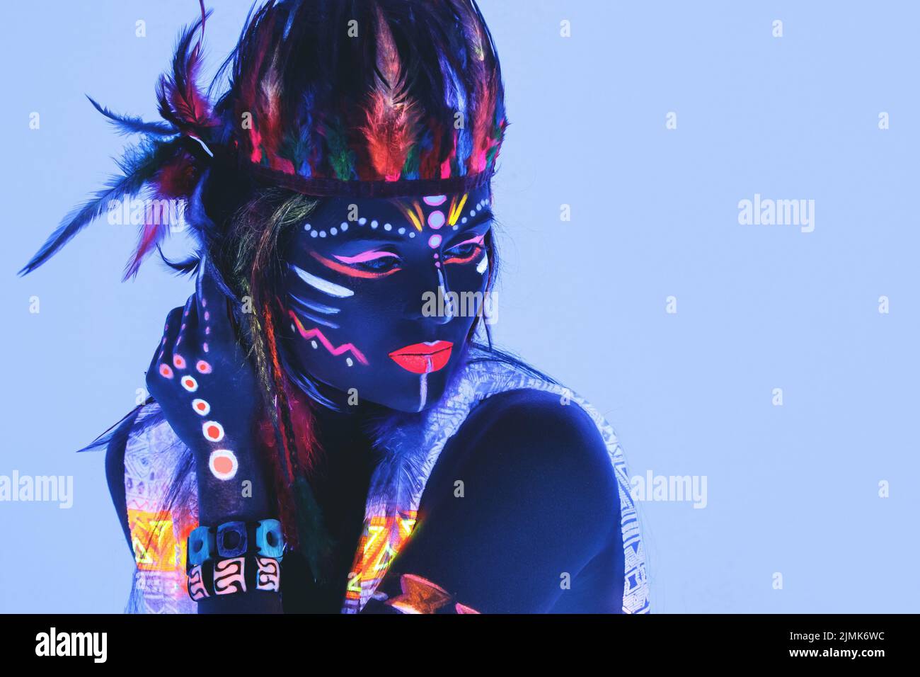 Model in image of Native american with neon makeup, which made of ...