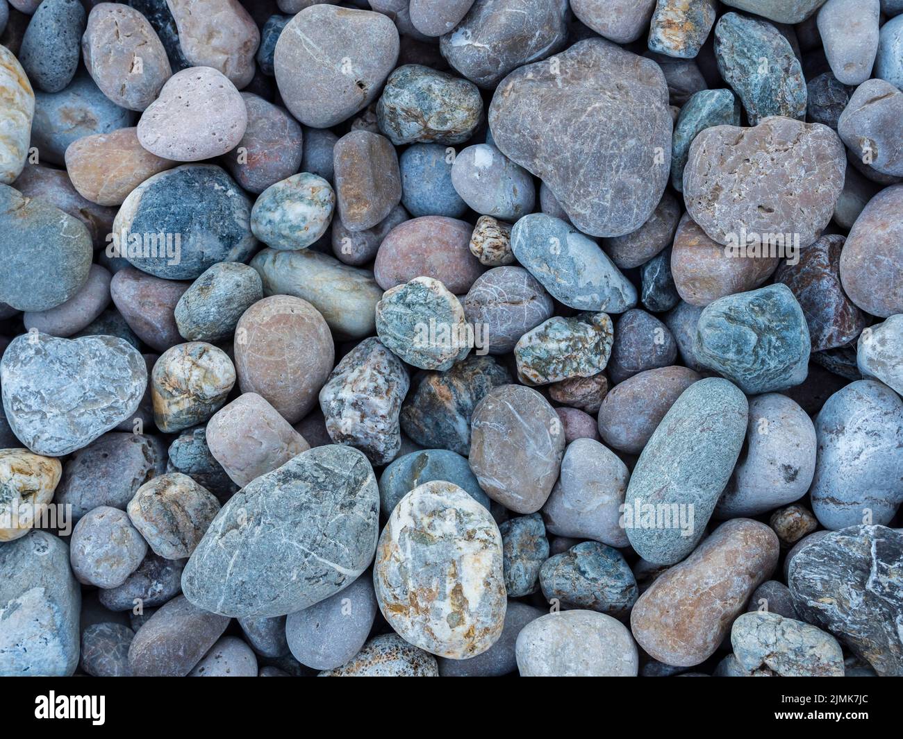 Pebbles on the beach of Stock Photo - Alamy