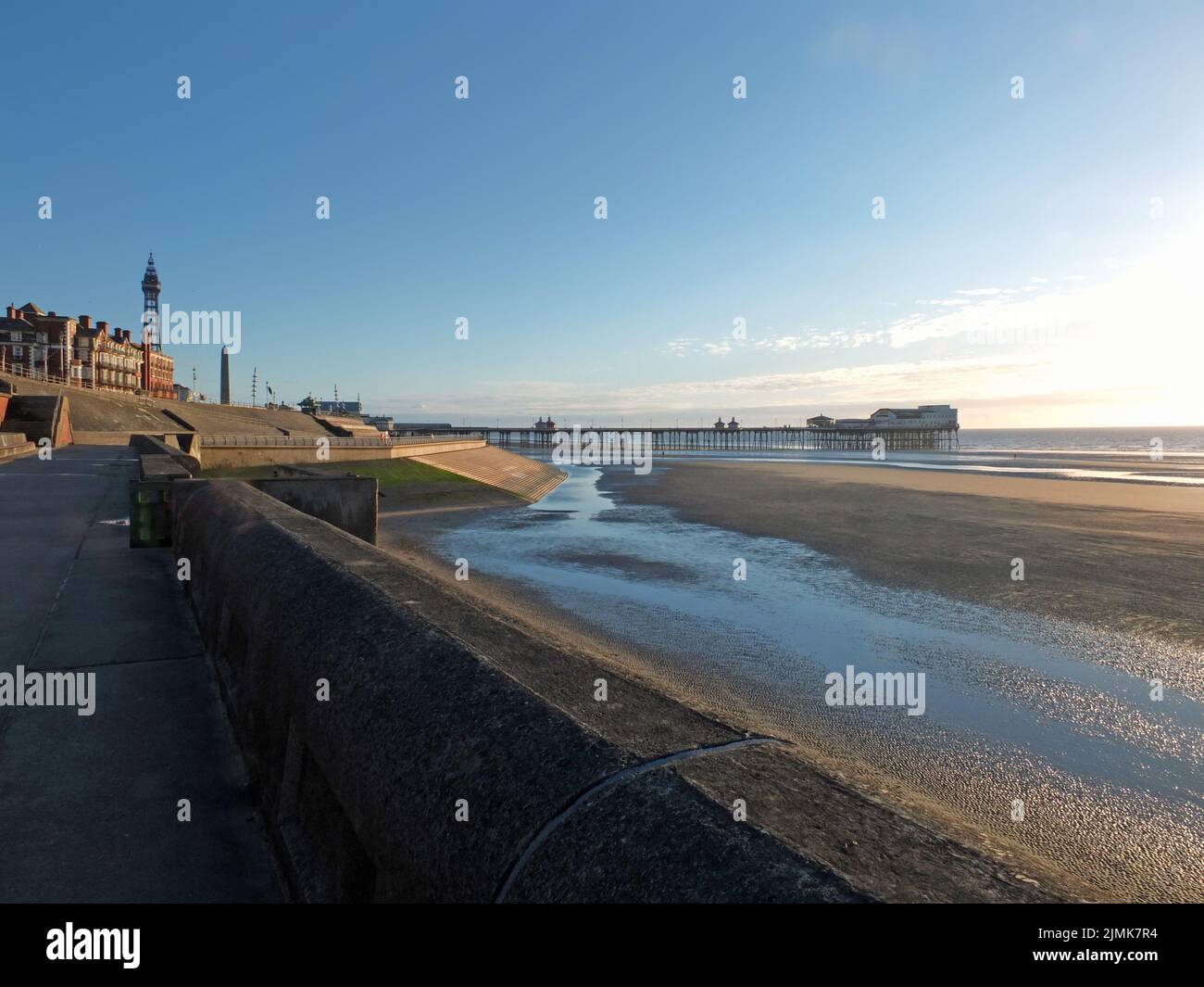 View of blackpool tower and south pier from the promenade with town ...