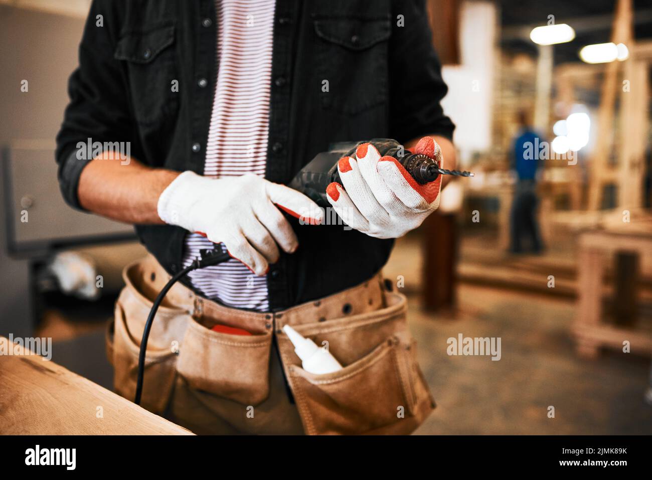Im ready to get my drill on. an unrecognizable carpenter holding an ...