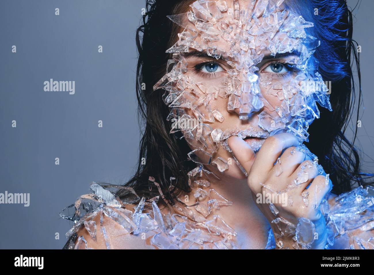 Female face covered with a lot small pieces of glass or ice Stock Photo ...