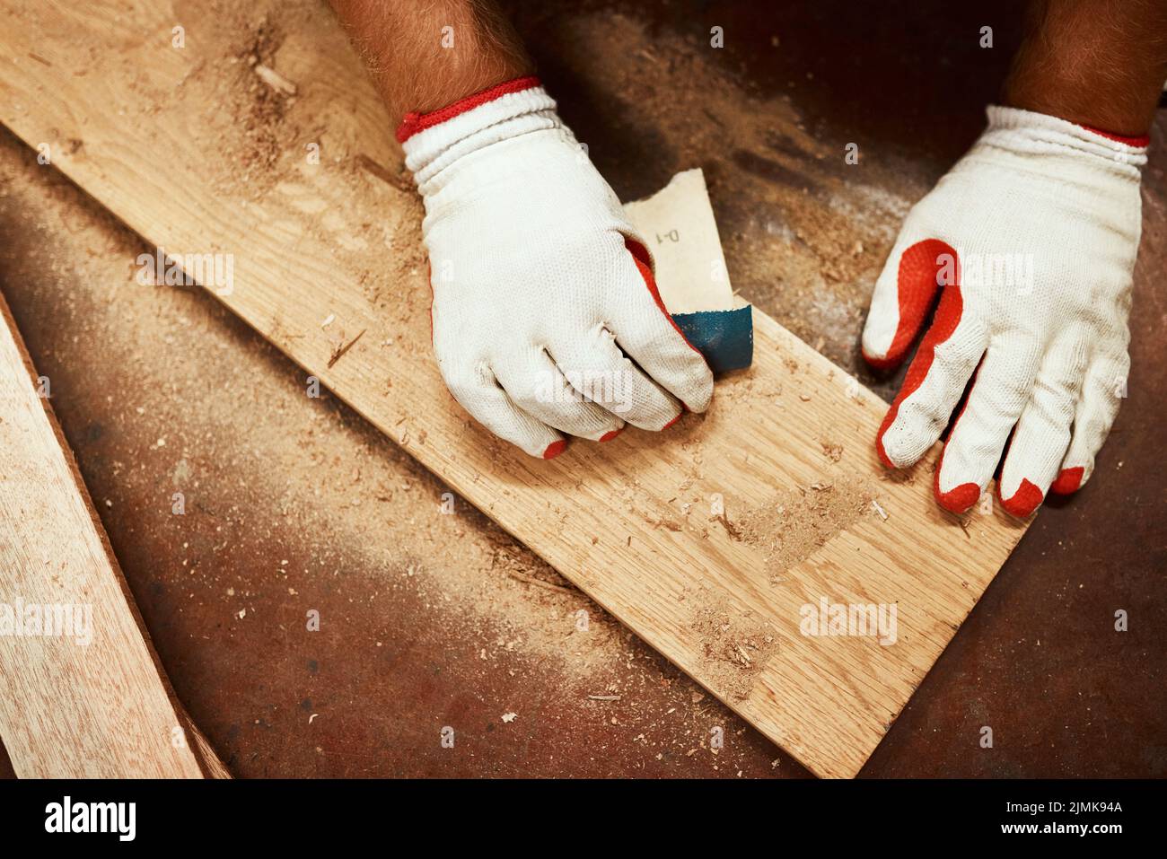 This was hard work. Closeup of an unrecognizable male carpenter using ...