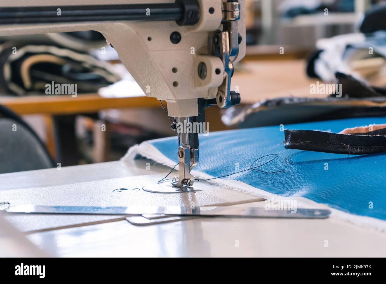 Sewing machine needles close-up in the workshop Stock Photo - Alamy