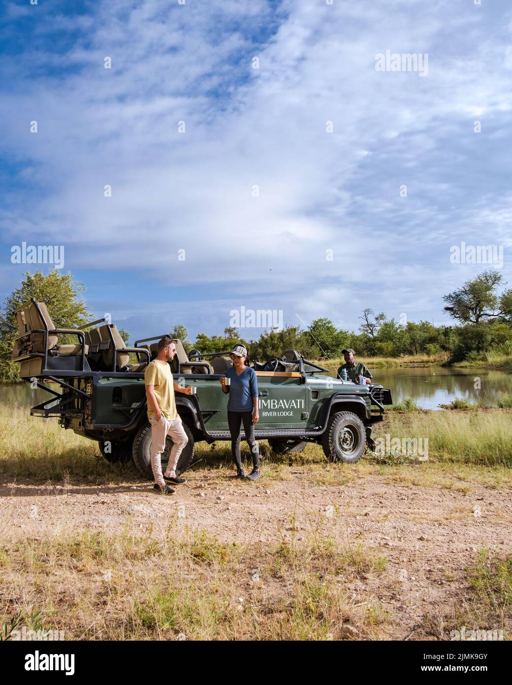 South Africa, luxury safari car during game drive, couple men and woman ...