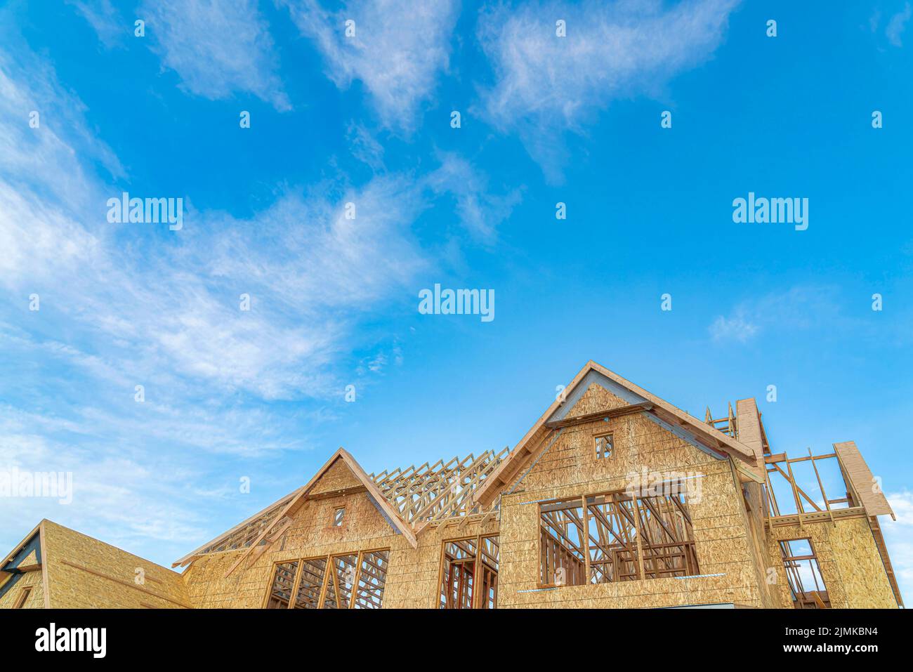 Wooden ceiling beams of an unfinished house at Daybreak, Utah. Exterior ...