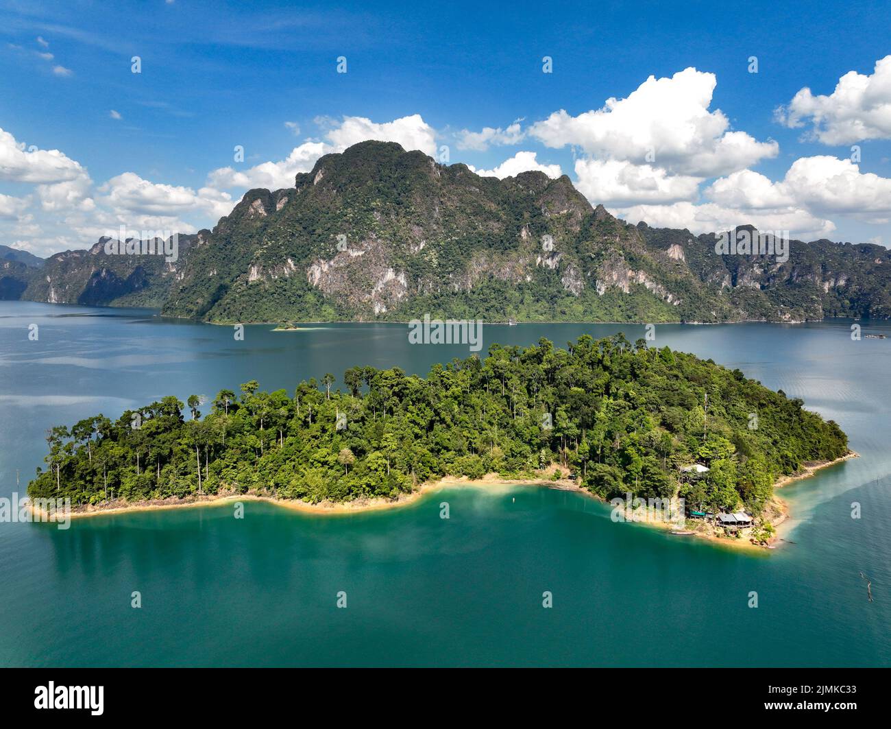 Aerial drone view of Frog island, tropical Mountain peak on the lake ...