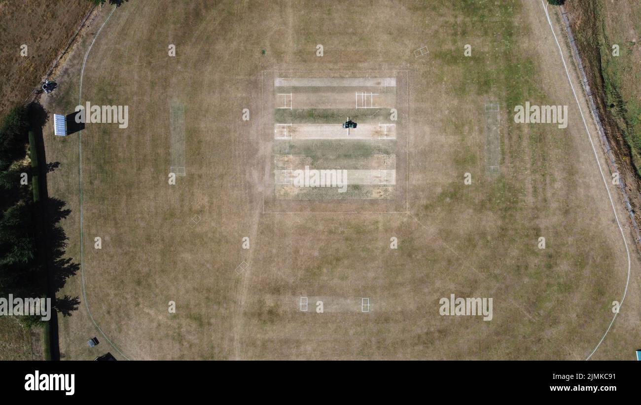 Uppingham, UK. 05th Aug, 2022. A groundsman works on the cricket square ...