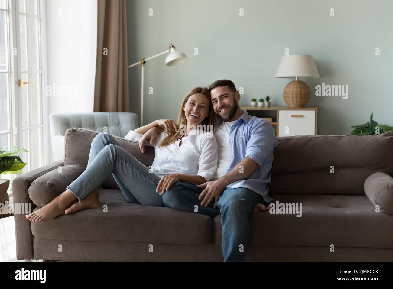 Happy millennial couple pose portrait hi-res stock photography and ...