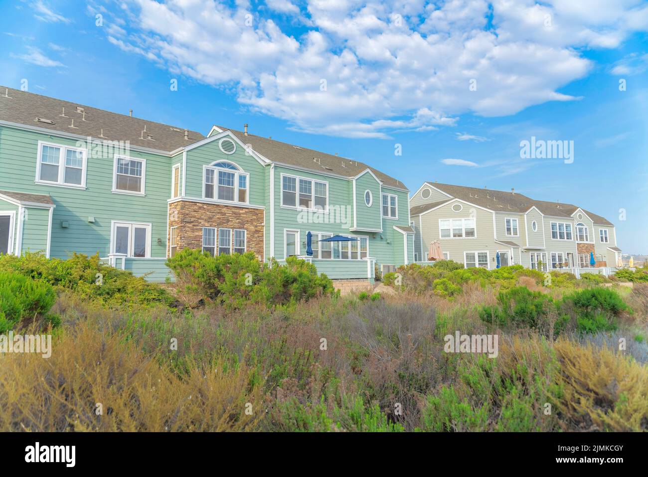 Townhouse complex buildings back door exterior at California. There is ...