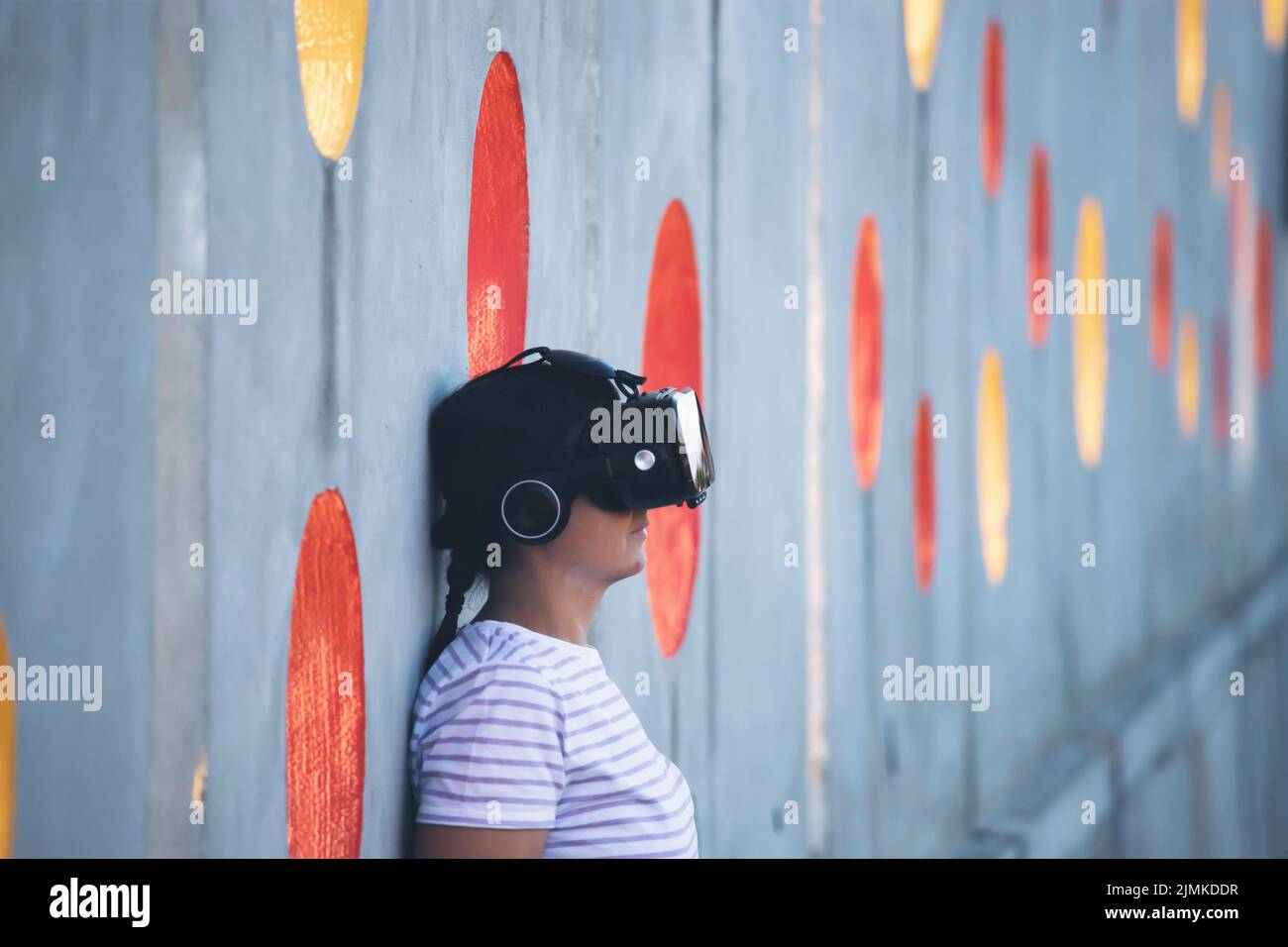 Woman wearing virtual reality goggles. Metaverse, technology, video ...