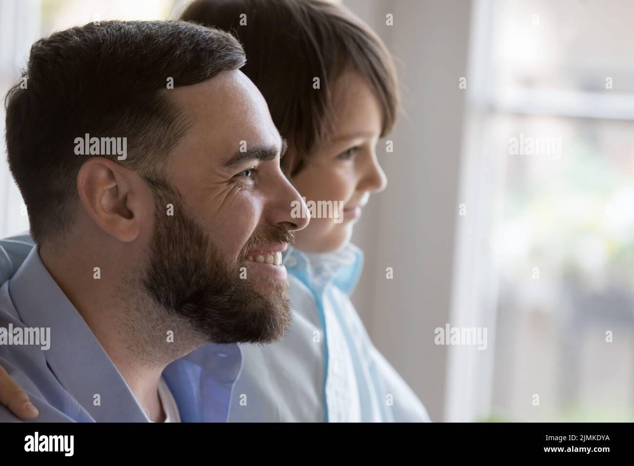Close up profile faces of young father and little son Stock Photo - Alamy