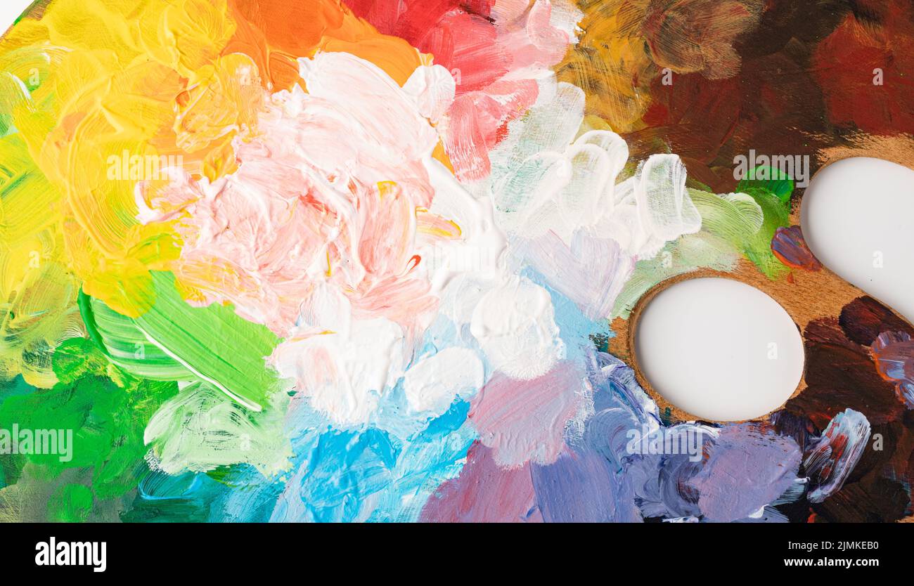 Art palette with colorful mixed paints Stock Photo - Alamy