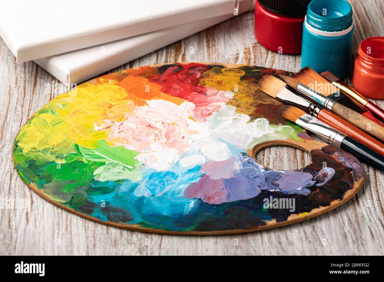Art palette with colorful mixed paints Stock Photo - Alamy