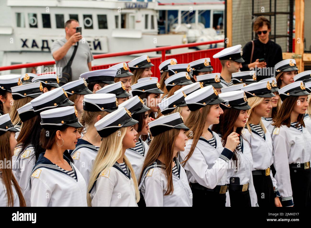 Graduates dressed in uniforms are seen during the ceremony. Graduation ...