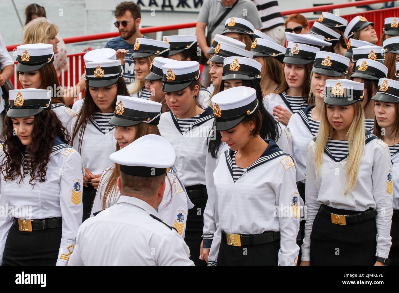 Graduates dressed in uniforms are seen during the ceremony. Graduation ...