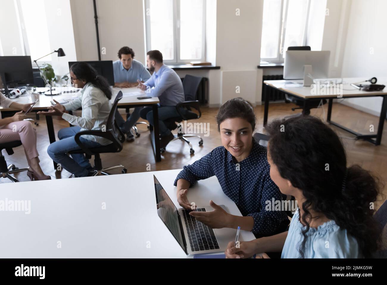 Multi racial company employees working together in co-working Stock ...