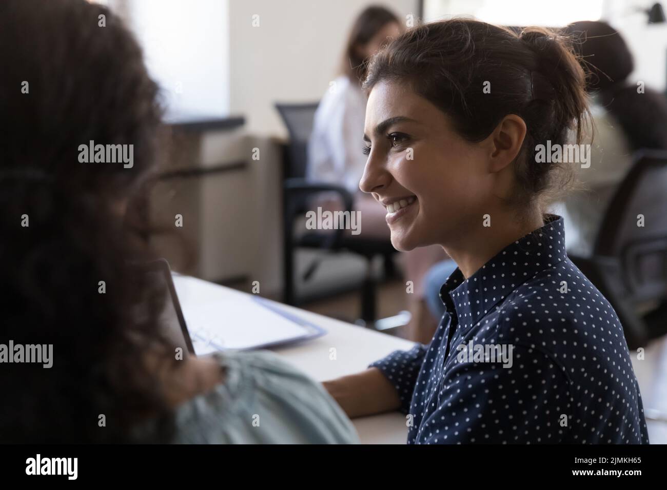 Indian office employee listen to colleague or mentor at workplace Stock ...