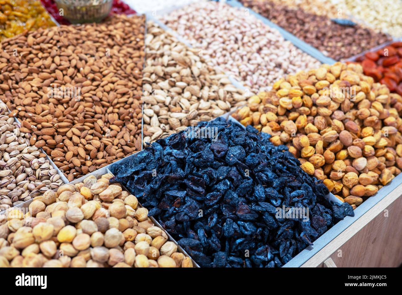 Dried fruits and nuts on food market Stock Photo - Alamy