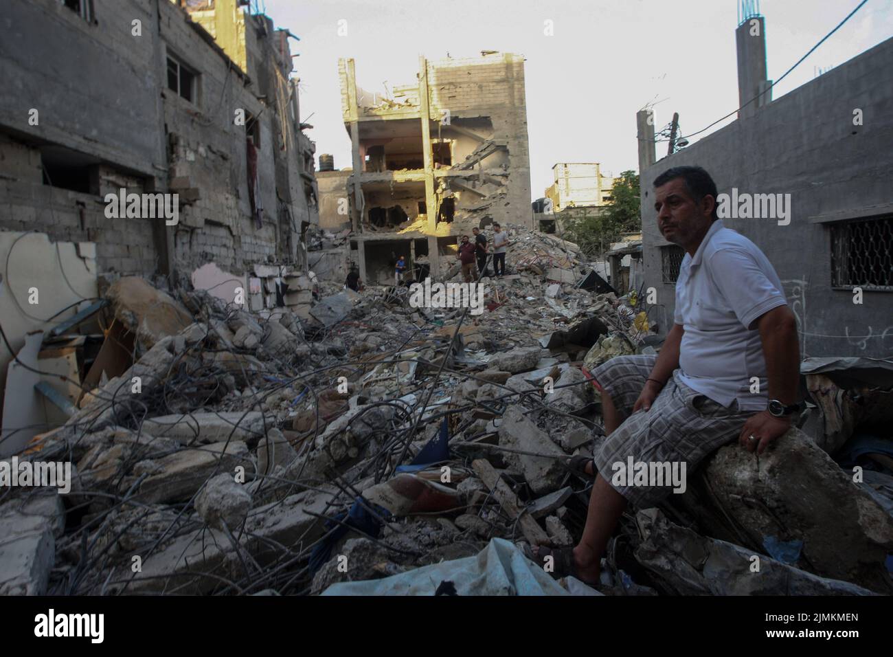 Rafah, Gaza. 07th Aug, 2022. Palestinians sit on the rubble of a ...