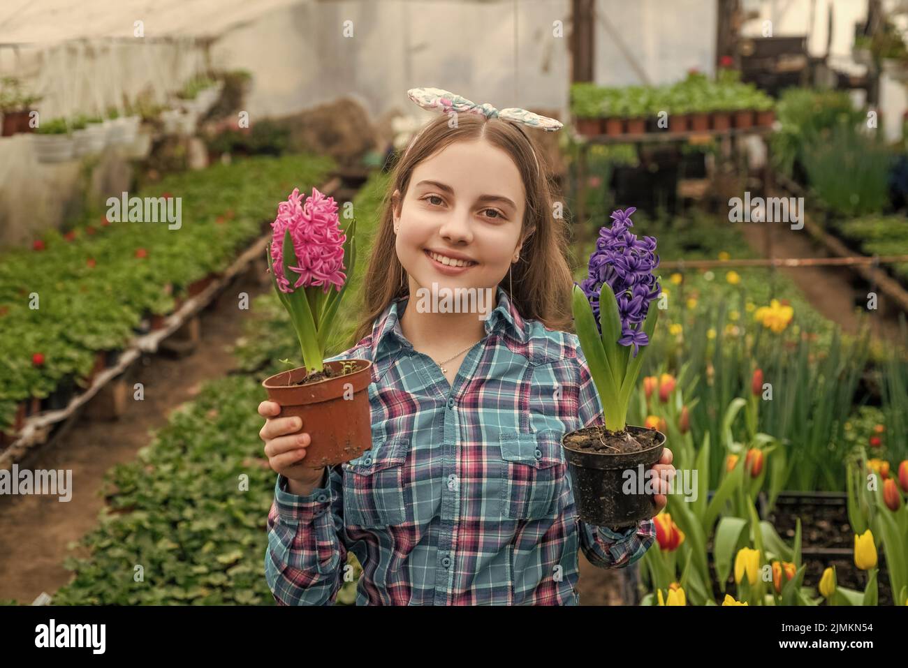 nice flowers. child gardener. flowers in garden. daily chores. flower ...