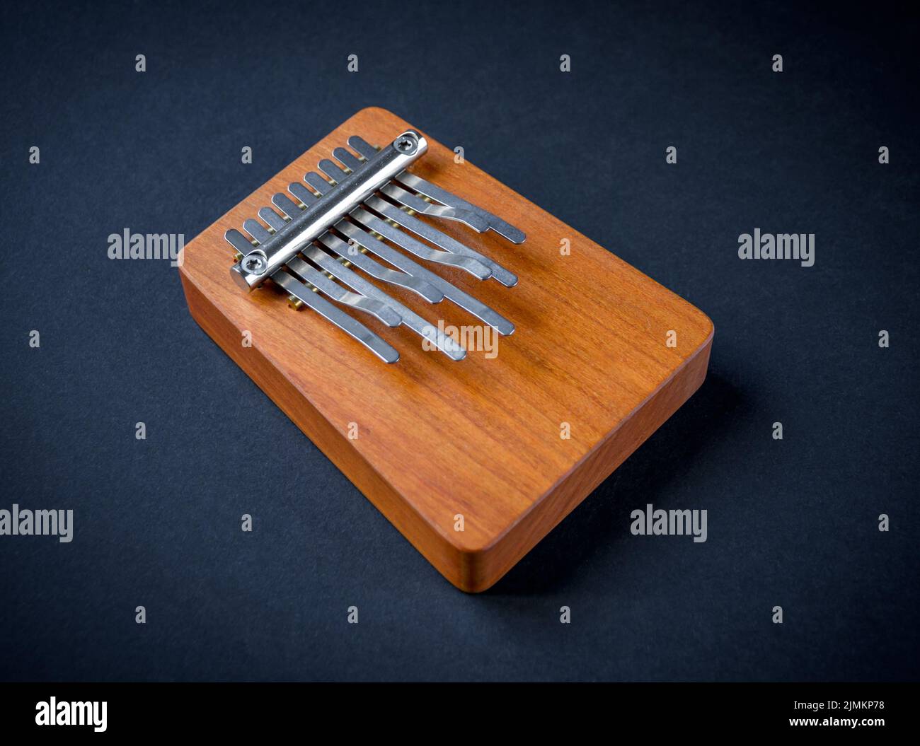 Traditional wooden kalimba isolated on black Stock Photo - Alamy