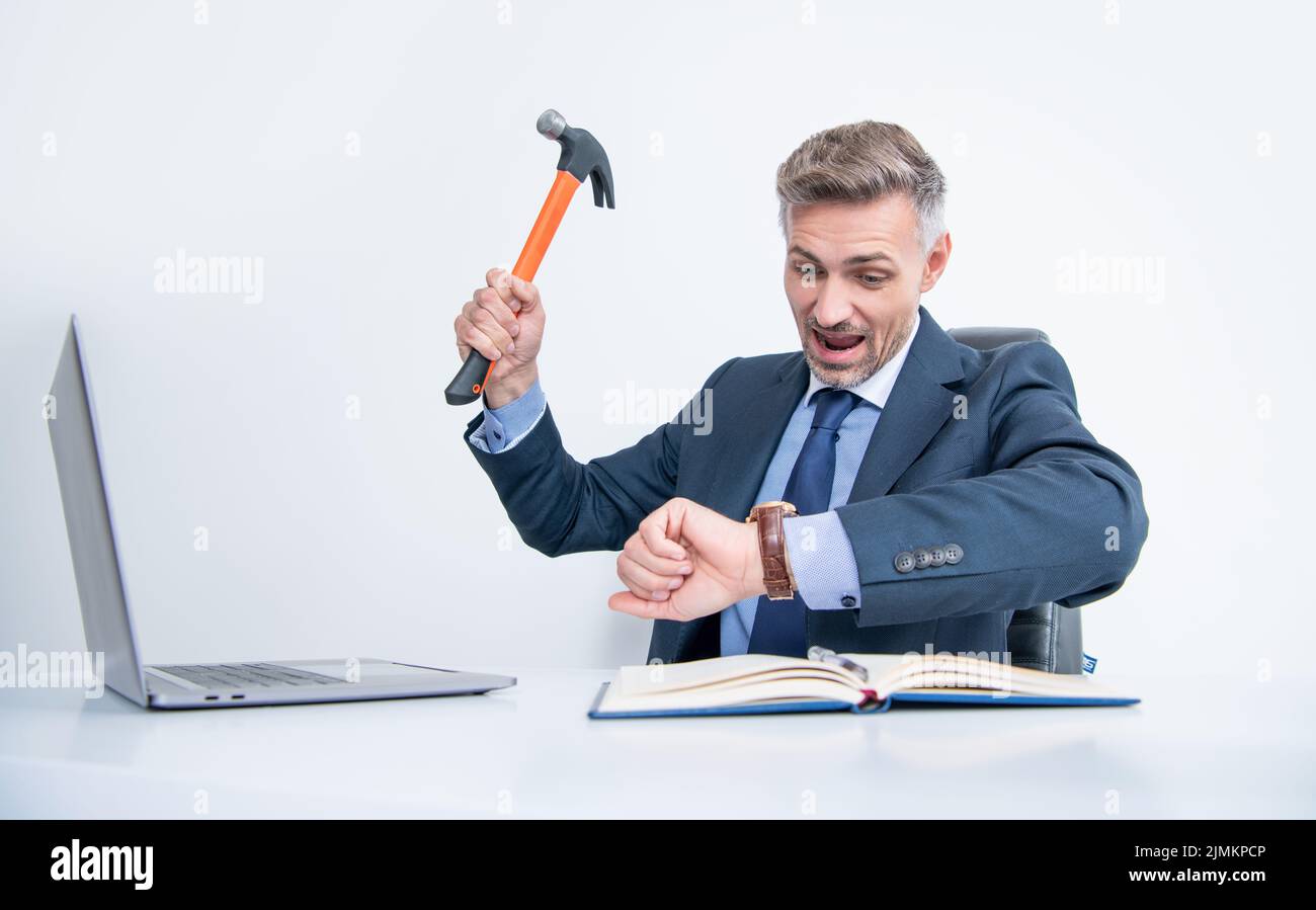 shocked boss hitting laptop with hammer and checking time Stock Photo ...