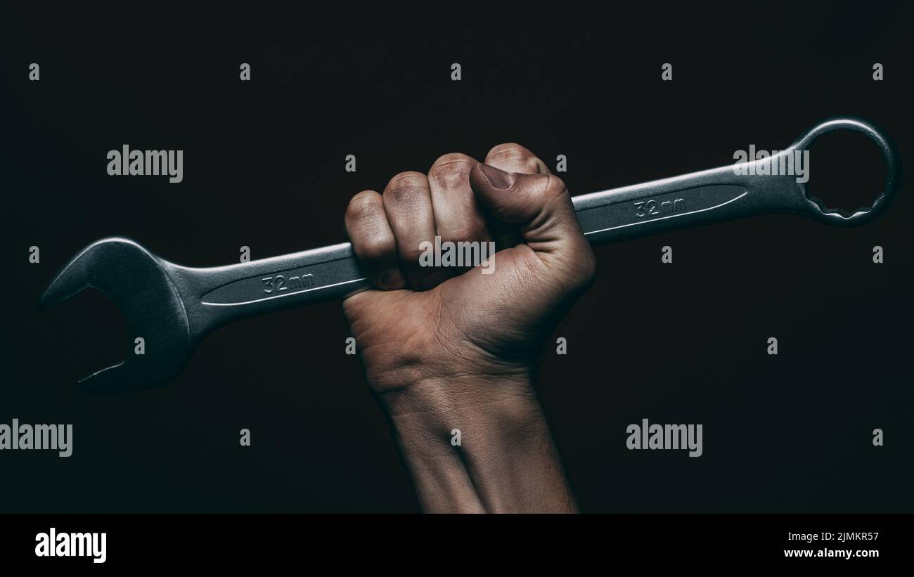 Hand mechanic holding wrench hi-res stock photography and images - Alamy