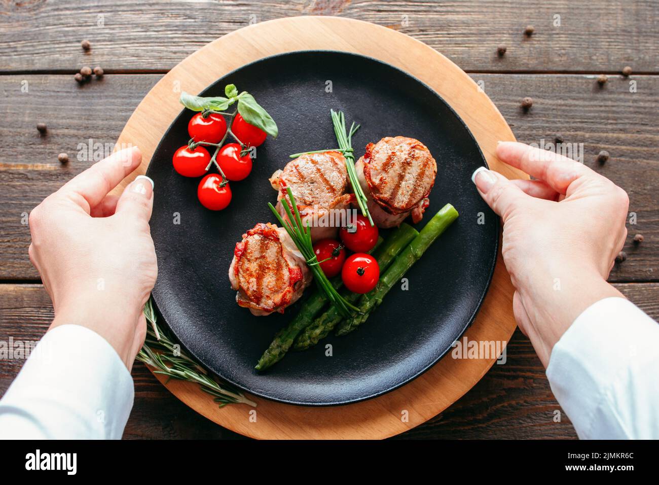 food stylist decor pork grilled pork medallions Stock Photo - Alamy