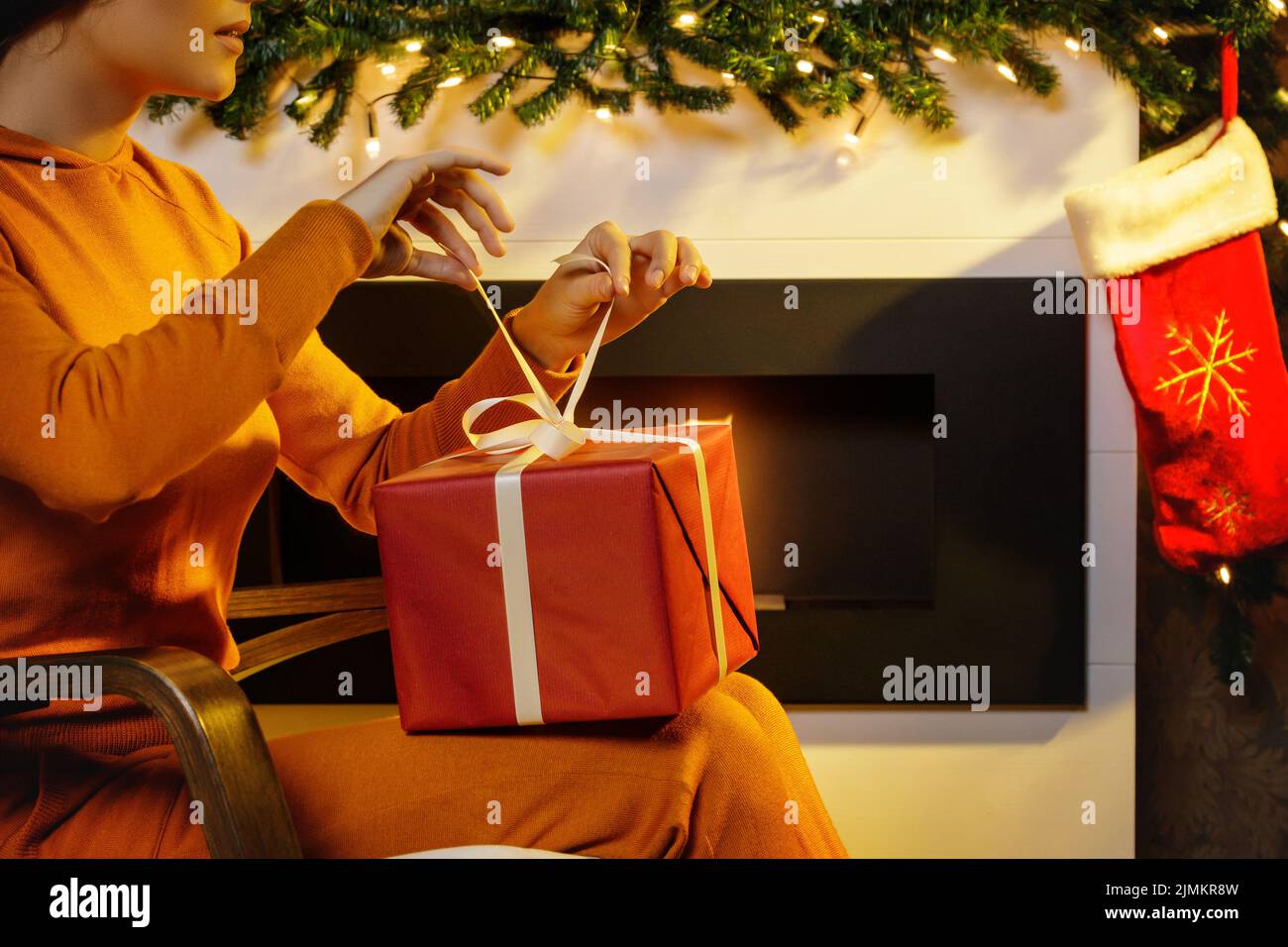 Female hands opening Christmas gift in the red box Stock Photo - Alamy