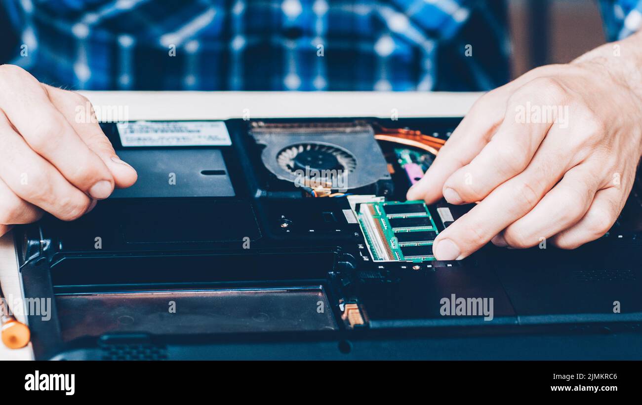computer repair shop disassembled parts technician Stock Photo - Alamy