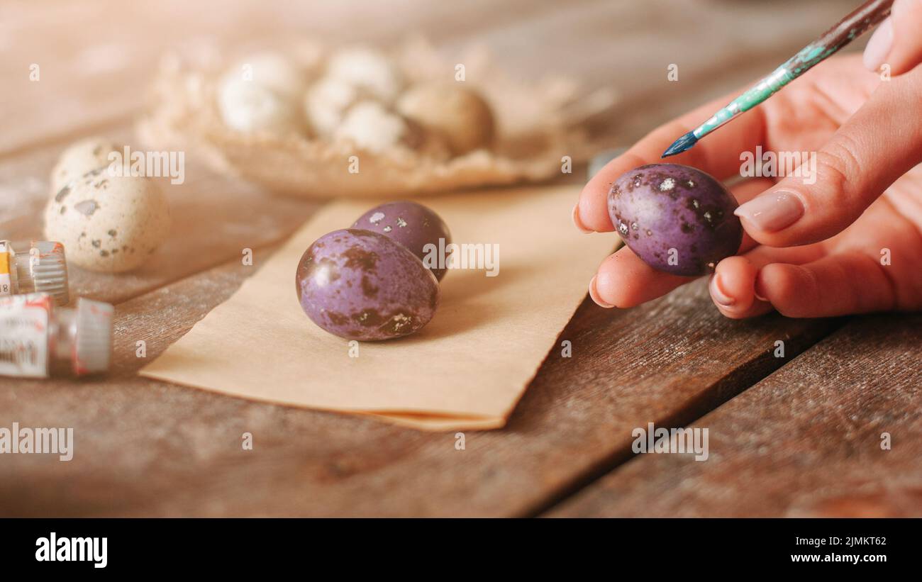 diy easter decoration female artist painting eggs Stock Photo - Alamy