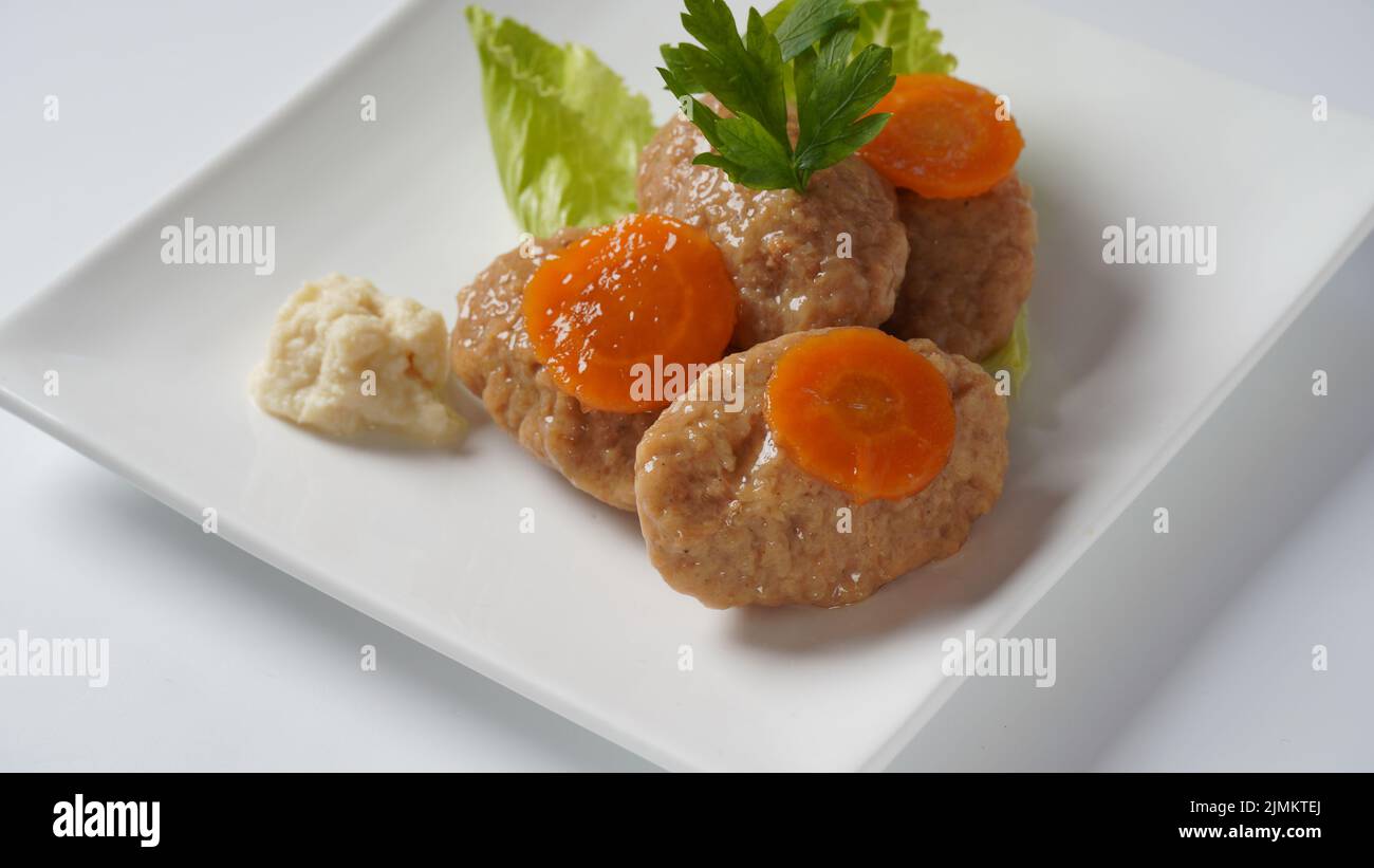 Traditional Jewish Passover food gefilte fish with carrots, horseradish ...