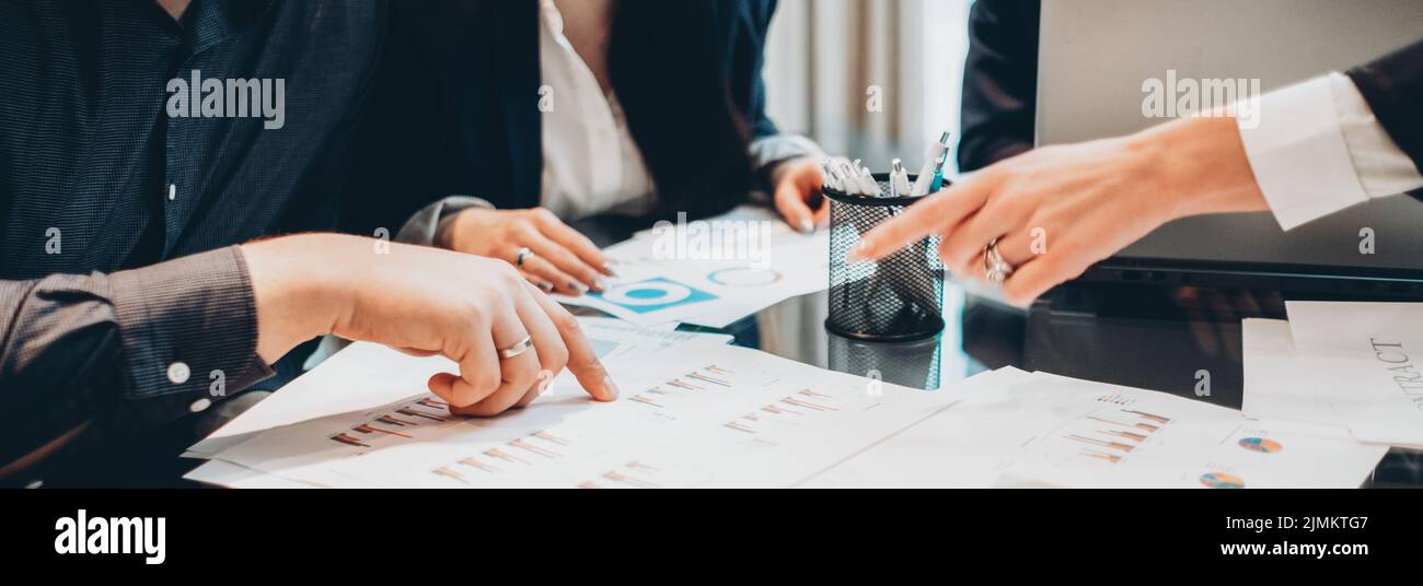 teamwork brainstorming business partners graphs Stock Photo - Alamy