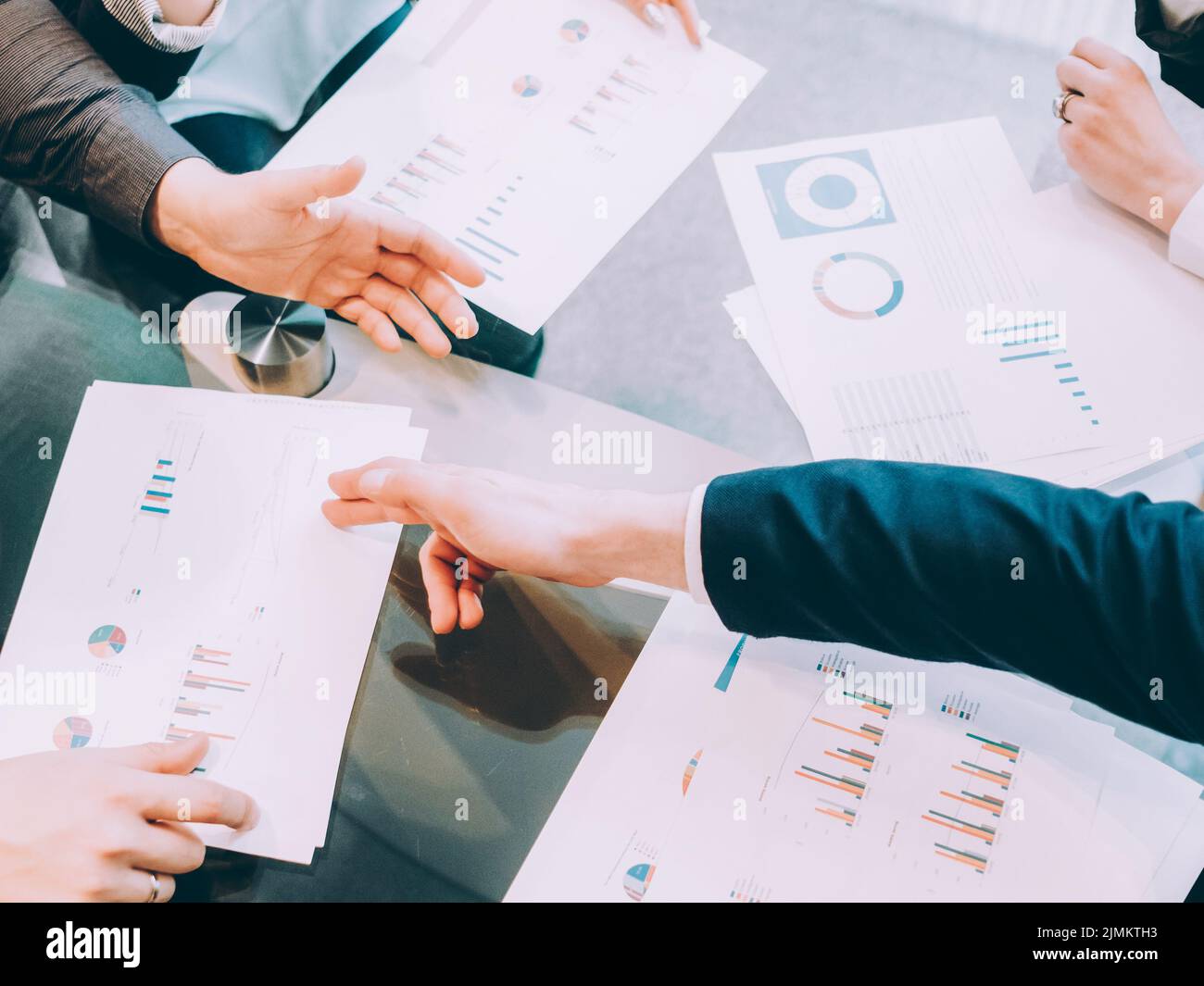 corporate meeting professional team graphs charts Stock Photo - Alamy