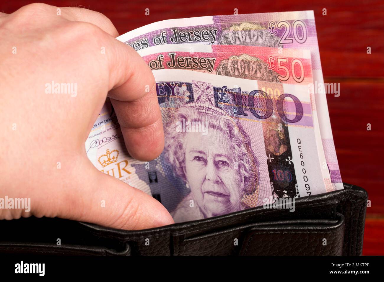 Jersey money - pounds in the black wallet Stock Photo - Alamy