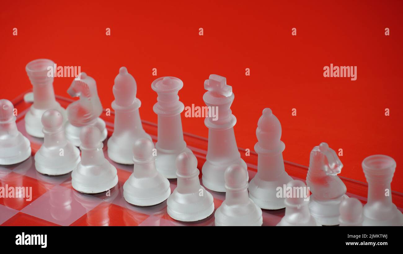 Transparent chess figures, on starting position, on reflective chess ...