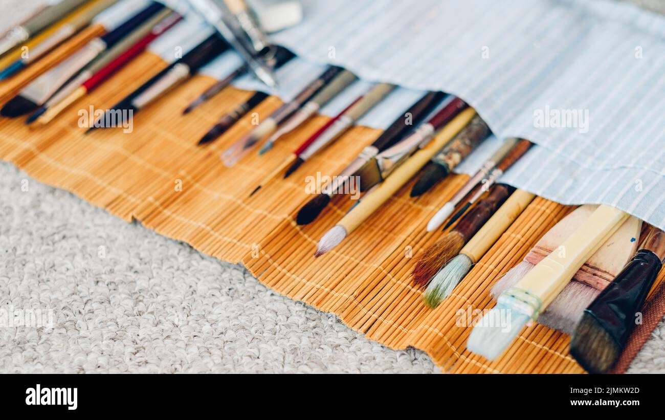 artist essential tools paintbrushes set organizer Stock Photo - Alamy