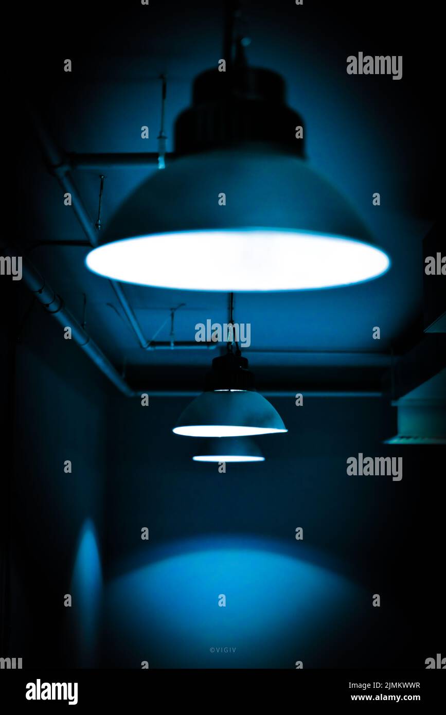 The lightened lamps hanging on the ceiling inside the building Stock ...