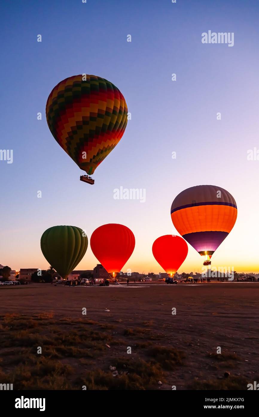 Inflation and flying hot air balloons in the morning at the field in ...