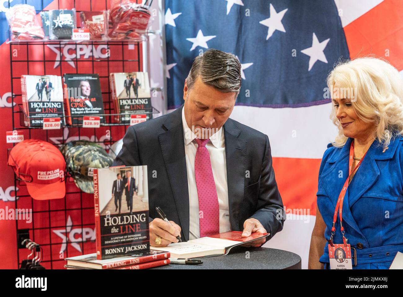 Congressman Ronny Jackson signs his book during CPAC Texas, USA ...